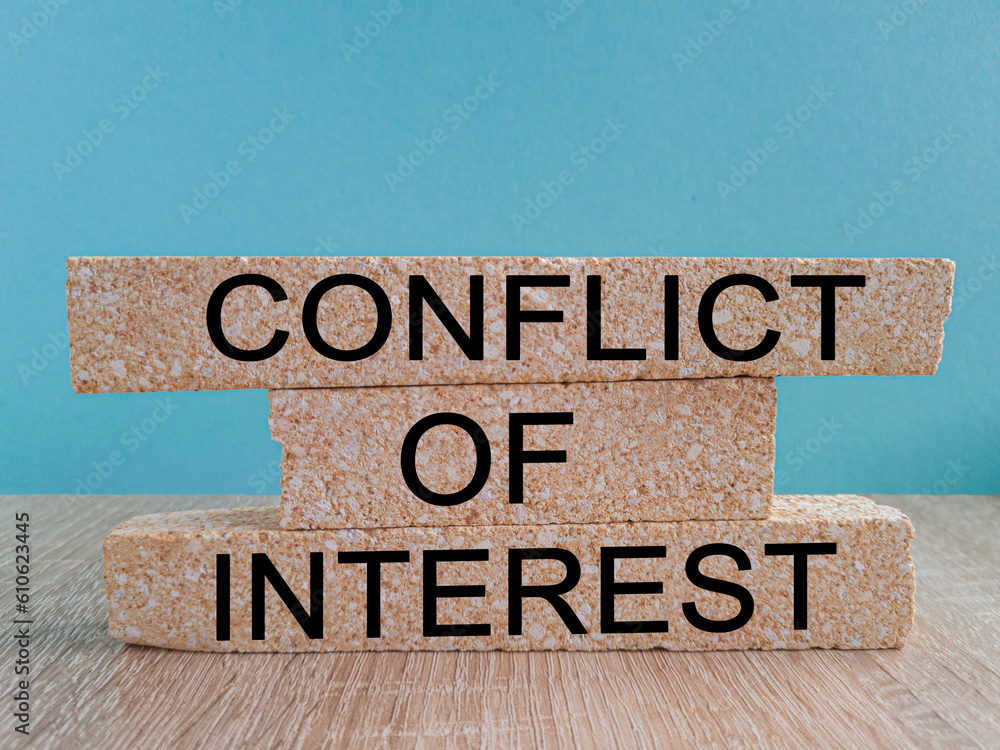 Conflict of interest symbol. Brick blocks with words 'conflict of ...
