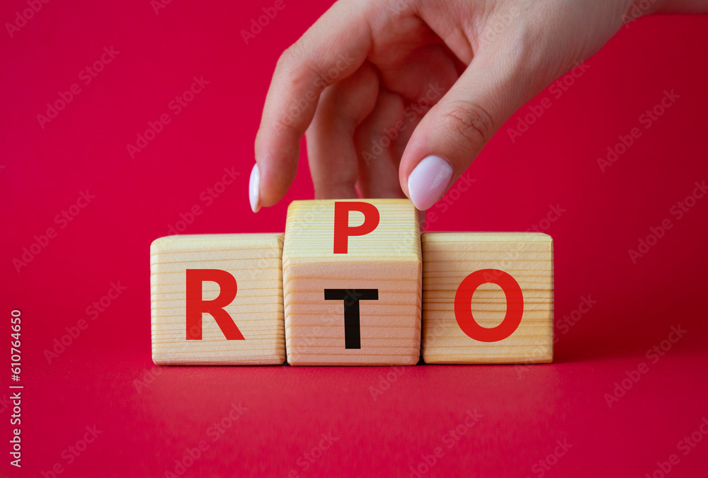 RPO vs RTO symbol. Businessman hand turns wooden cubes and changes the ...
