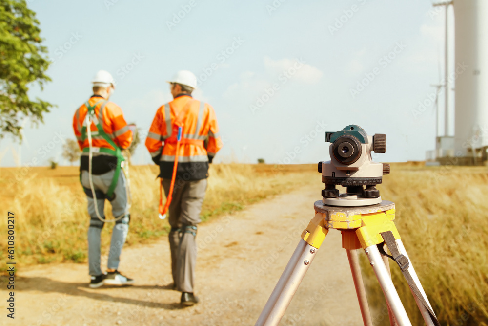 Back view Architect male surveyor team working with surveyor's ...