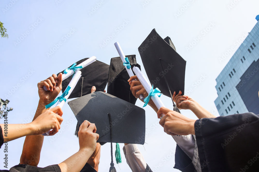 Education, graduation and success concept - Hands of happy graduation ...