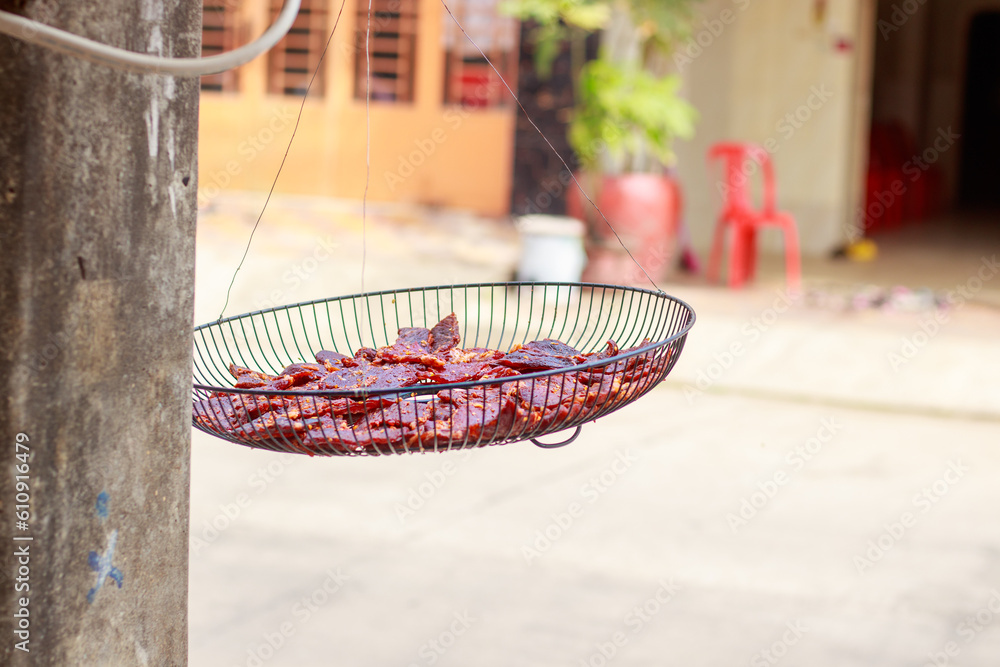 Traditional beef jerky or sach ko ngeat hanged on the side of the ...