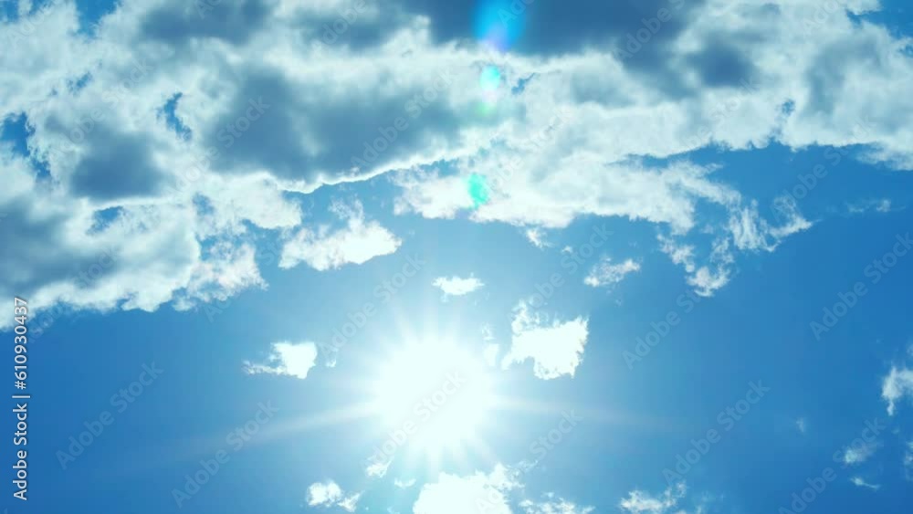 Sun Illuminates With Beams And Glare Blue Sunny Sky And White Clouds ...