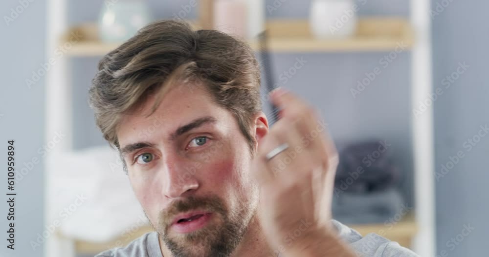 Comb, face and man brushing his hair in a bathroom for beauty, care and ...