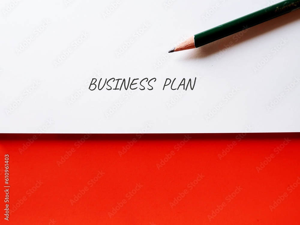 Pencil writing on document paper BUSINESS PLAN, concept of describes in ...