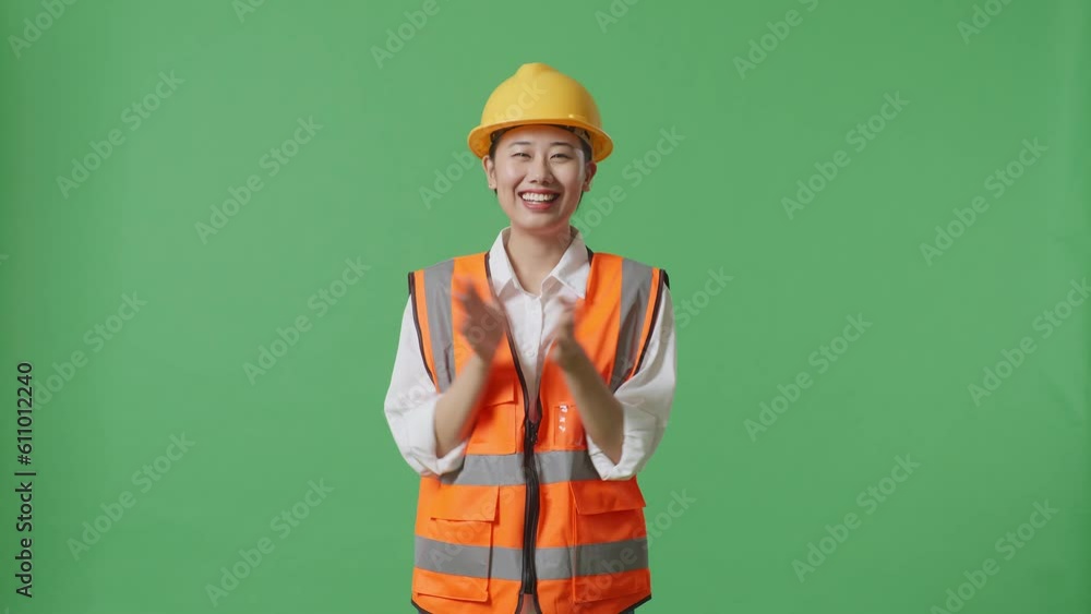 Asian Female Engineer With Safety Helmet Smiling And Clapping Her Hands ...