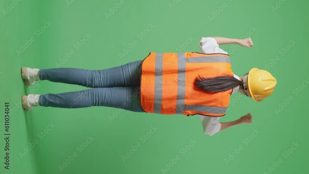Full Body Back View Of A Female Engineer With Safety Helmet Raising Her ...
