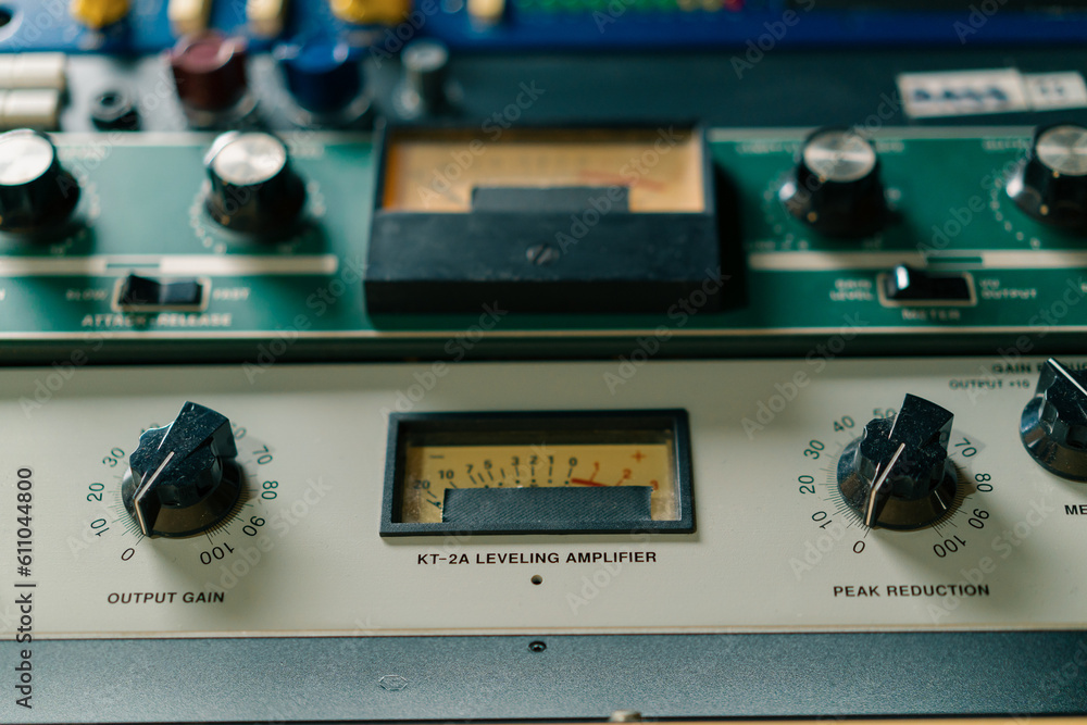 old displays of professional analog volume meters in a recording studio ...