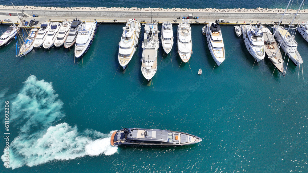 Aerial drone photo of small luxury yacht manoeuvring to dock in ...