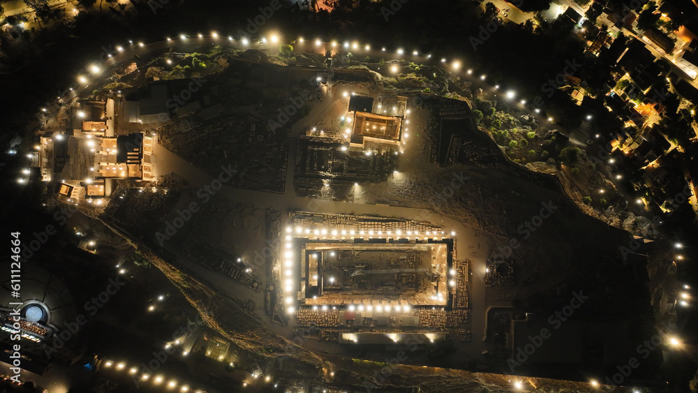 Aerial drone night shot of iconic illuminated Acropolis hill and the Parthenon an Unesco world ...