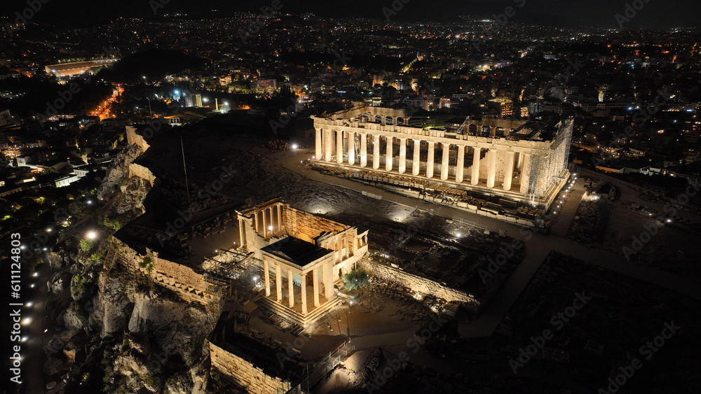 Aerial drone night shot of iconic illuminated Acropolis hill and the Parthenon an Unesco world ...