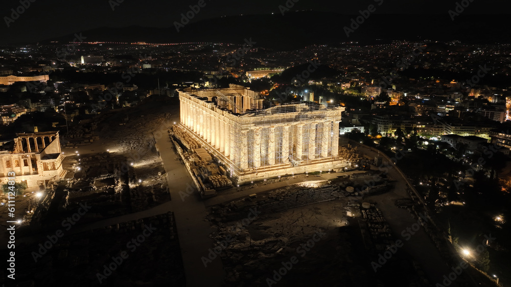 Aerial drone night shot of iconic illuminated Acropolis hill and the Parthenon an Unesco world ...
