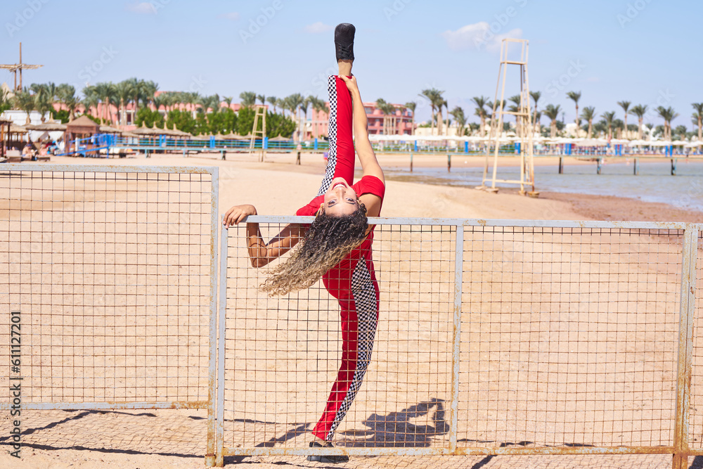 Sexy woman with slim figure in red suit and curly hair.Attractive ...