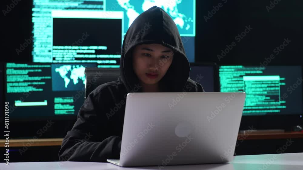 Asian Female Hacker In A Hood Looking At Camera And Crossing His Arms ...