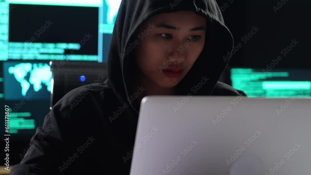 Stockvideon Close Up Of Asian Female Hacker In A Hood Showing Shh ...