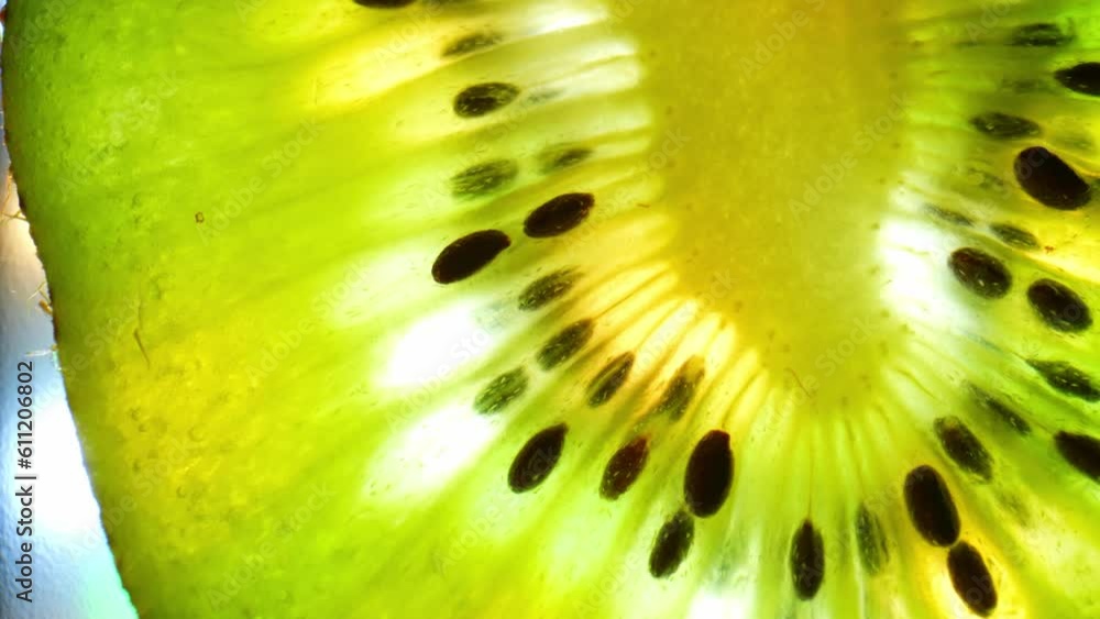 Macro video capturing the delectable cross-section of a kiwi fruit ...