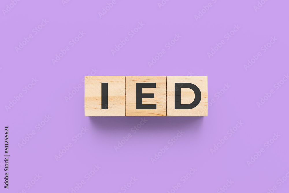 IED (Intermittent explosive disorder) wooden cubes on purple background ...