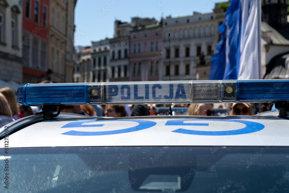 Police car lightbar emergency lights. Letters in Polish language ...