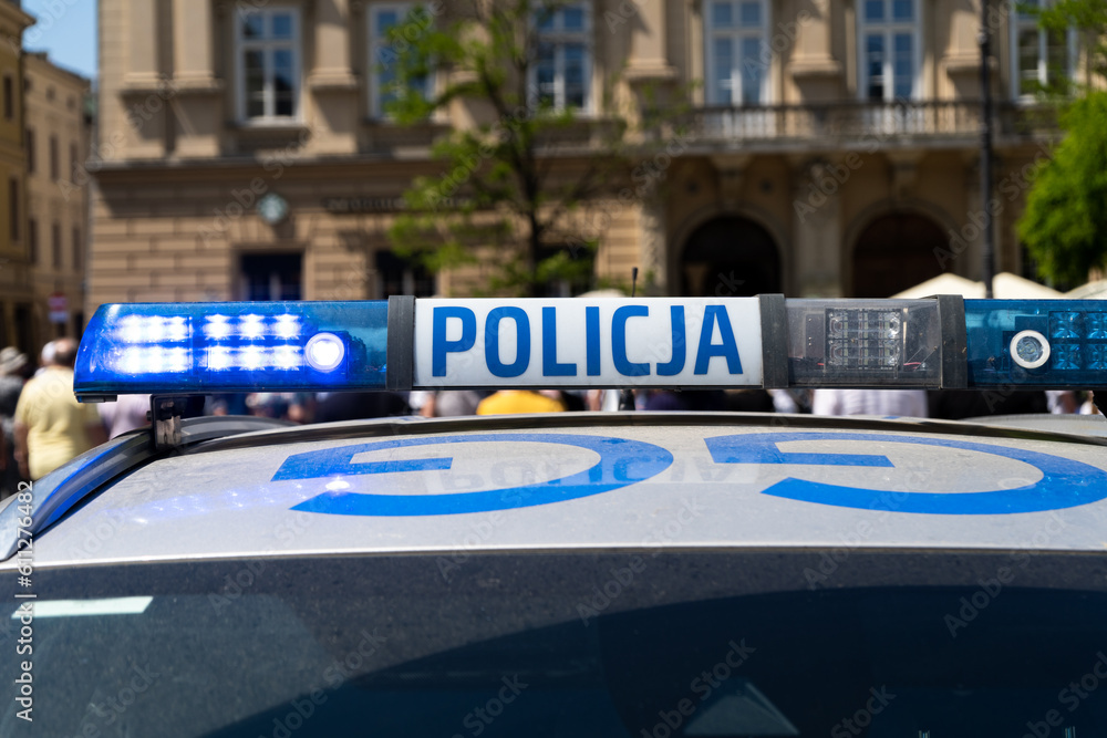 Police car lightbar emergency lights. Letters in Polish language ...