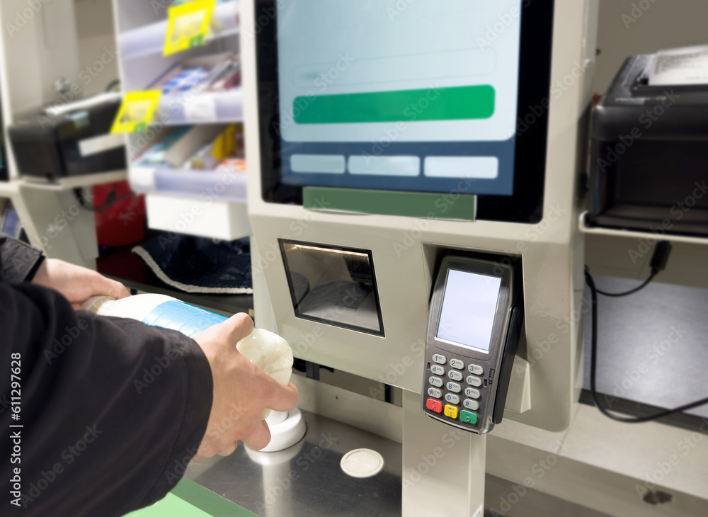 Customer pays his purchase at the supermarket,self checkout systems in ...