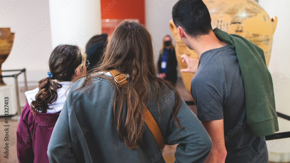 Group of students on excursion tour visit gallery museum with tour ...