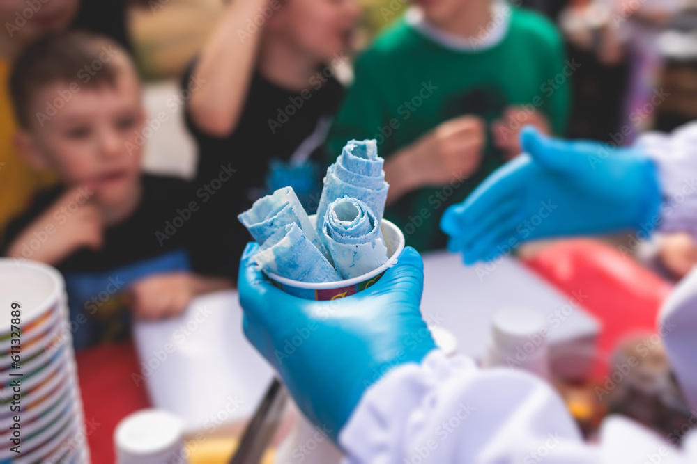 Rolled thai ice cream preparation, process of cooking coloured fried ...