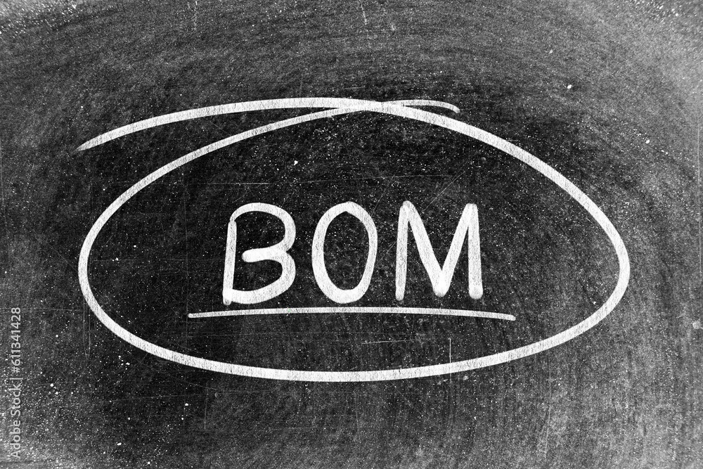 White chalk hand writing in word BOM (abbreviation of bill of materials ...