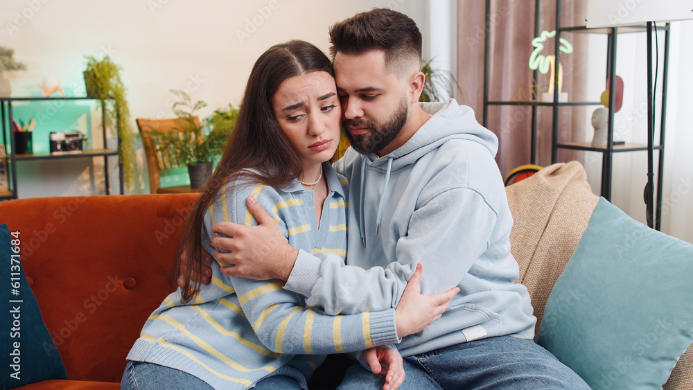 Compassion. Man supporting depressed offended woman of bad pregnancy ...