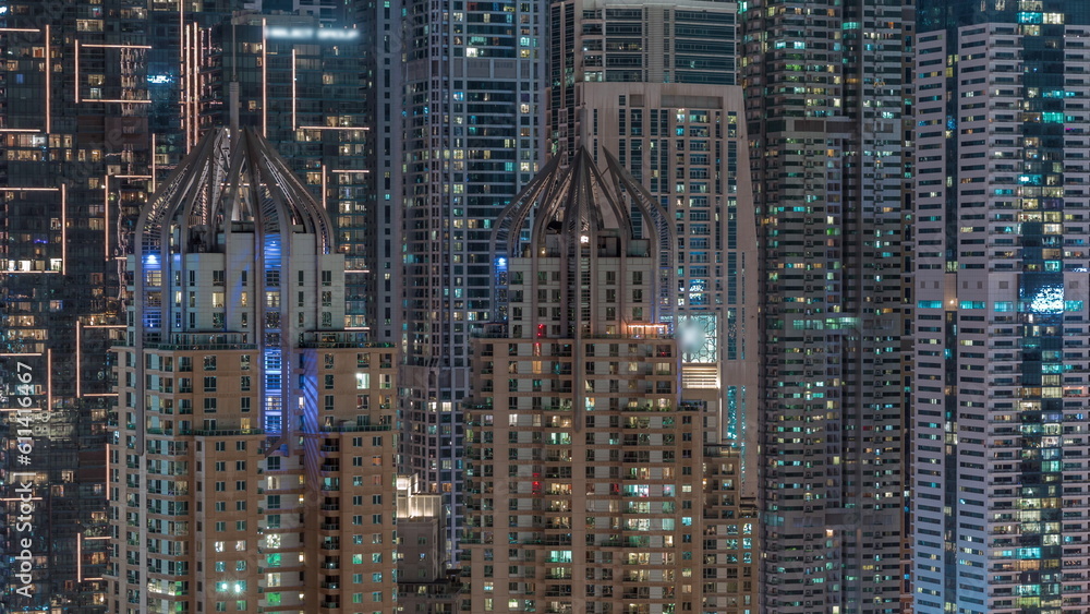 Windows in high-rise building exterior in the late evening with ...