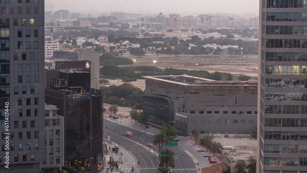 Skyline view of traffic on Al Saada street near DIFC district night to ...