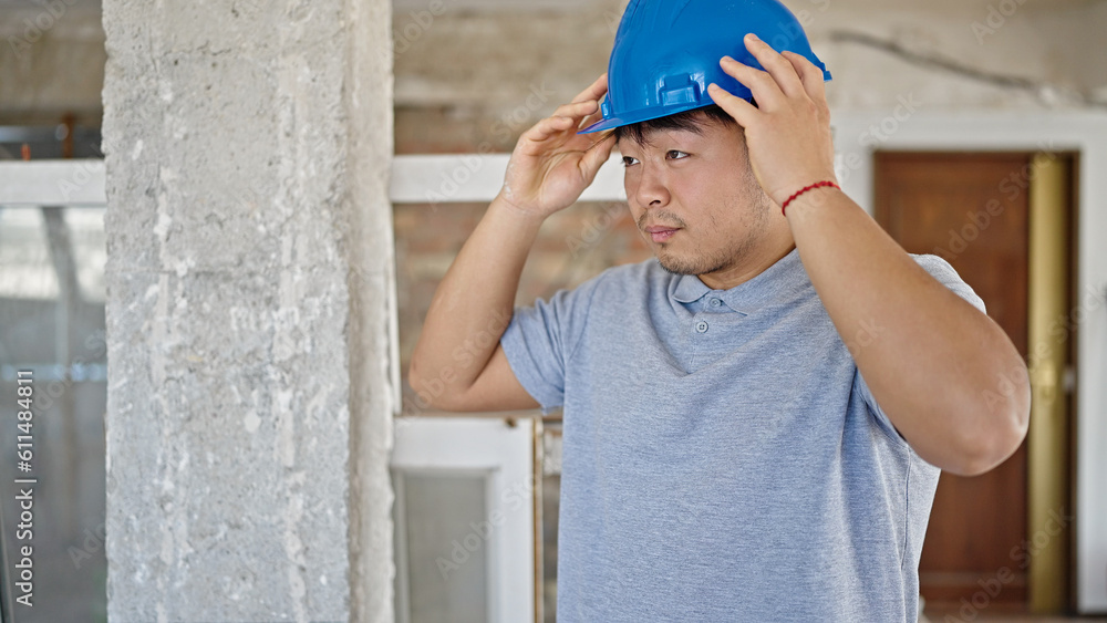 architect standing with serious expression at construction site Stock ...