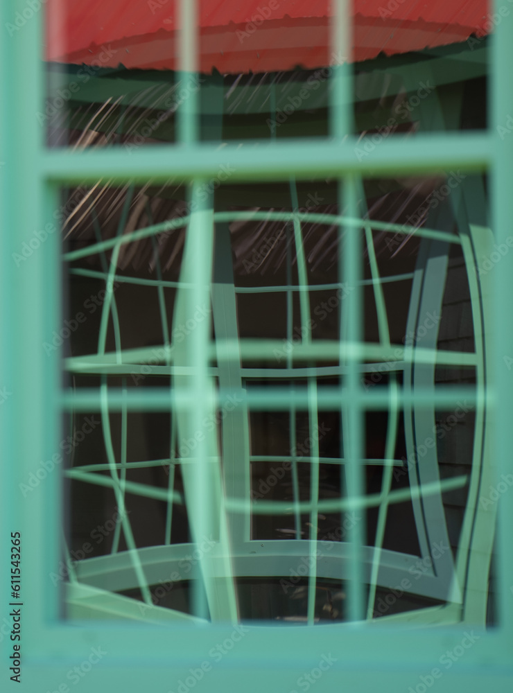 reflection in window of other windows with distortion from glass square ...
