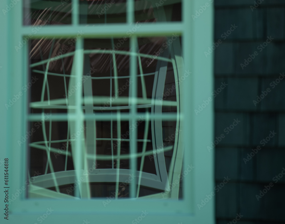 reflection in window of other windows with distortion from glass square ...