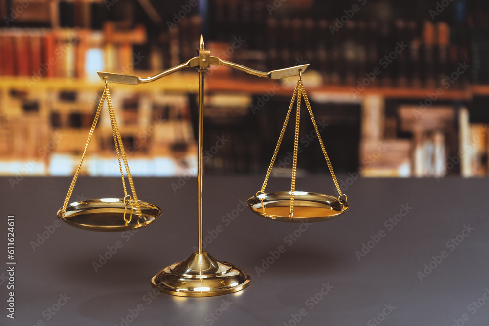 Shiny golden balanced scale in courtroom background as concept justice ...