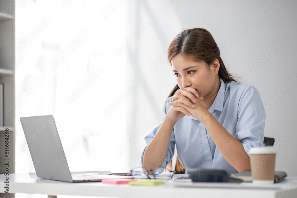 Puzzled confused asian woman thinking hard concerned about online ...