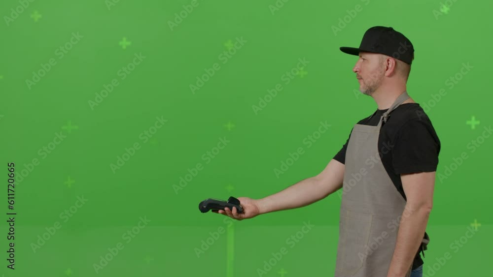 Side view of Caucasian male waiter hold wireless bank payment POS ...