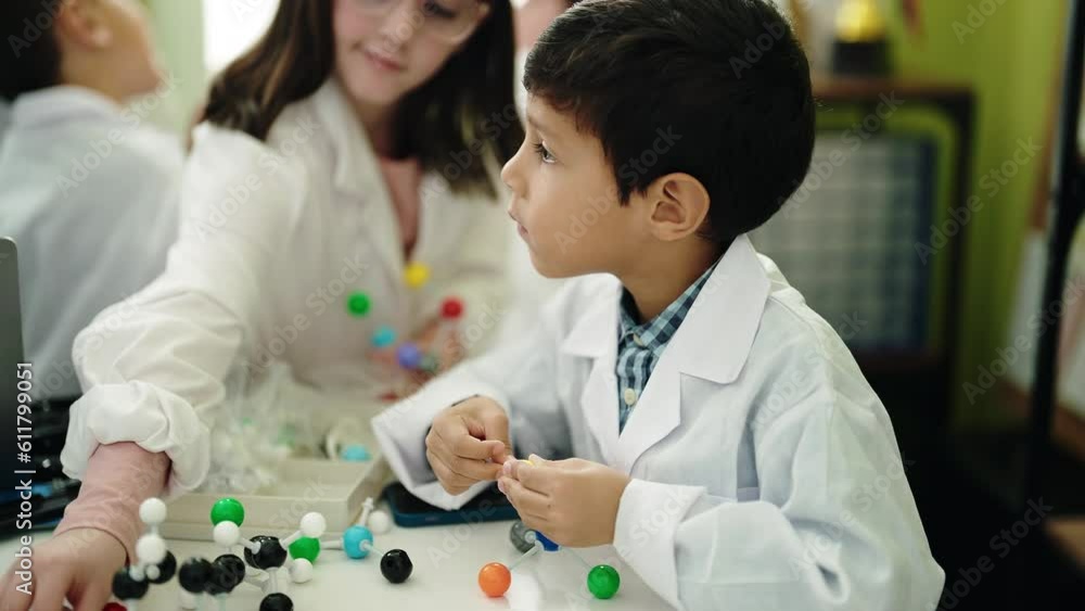 Group of kids scientist students holding molecules at laboratory ...