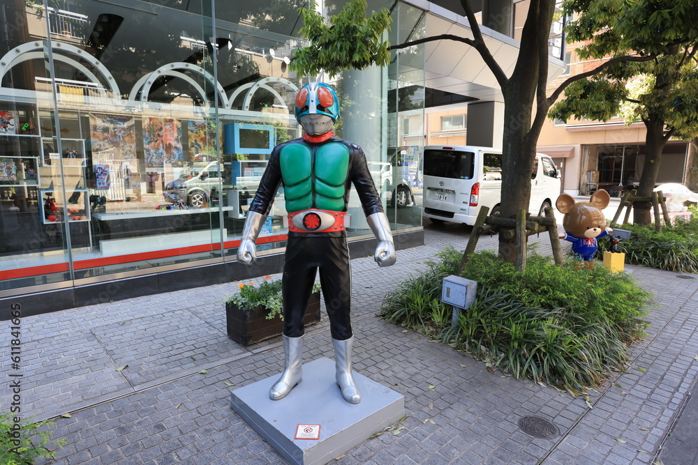 Tokyo, Japan - 3 May 2023: Bandai office and and statue of Kamen rider ...
