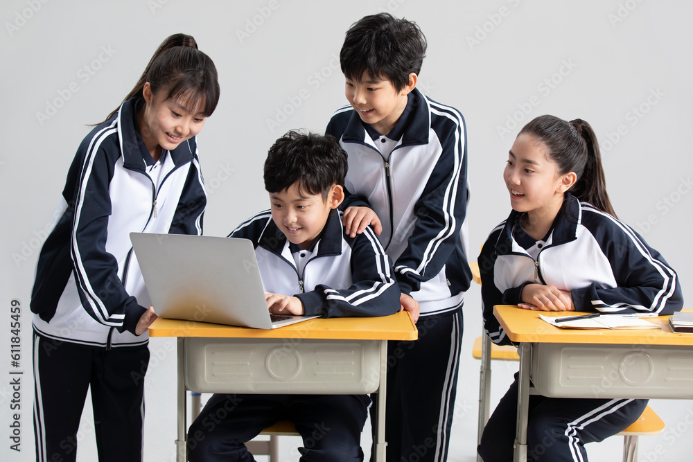 Students learning with laptop in classroom Stock Photo | Adobe Stock