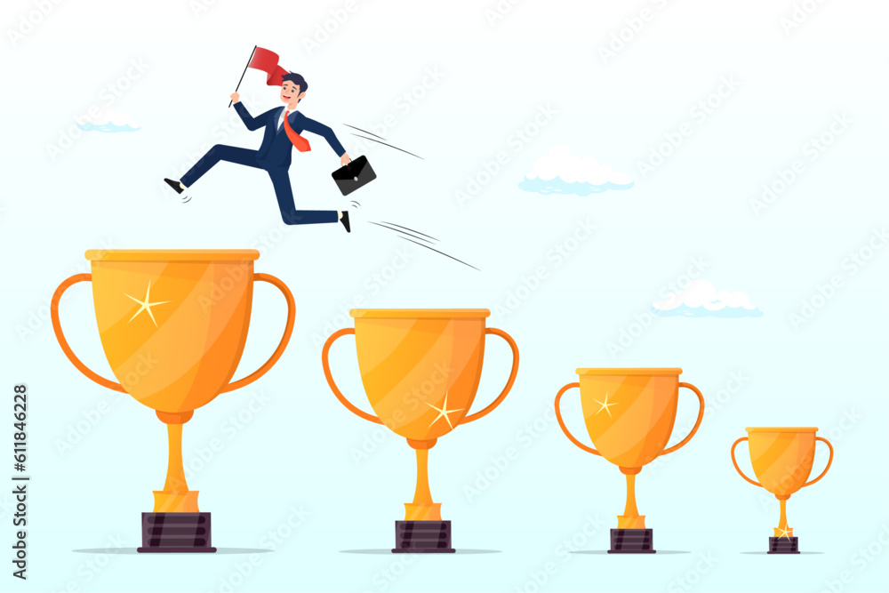 Confident businessman jumping from small win trophy to get bigger one ...