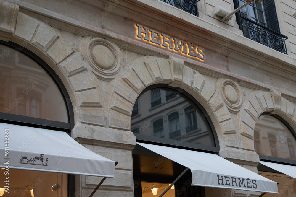 hermes logo brand and text on shop facade wall sign in the main ...