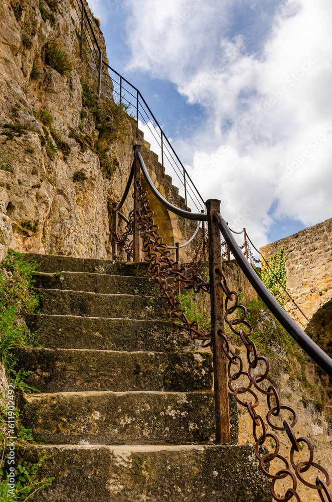 Ancient Beautiful stone steps with chain rail in Frias castle ...
