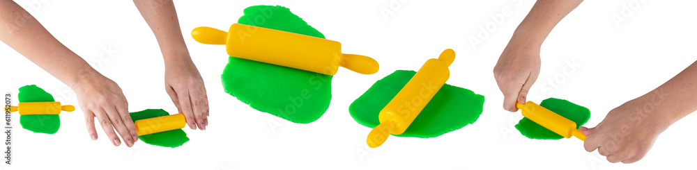 Rolling pin for plasticine rolls out dough-plasticine, isolated on ...