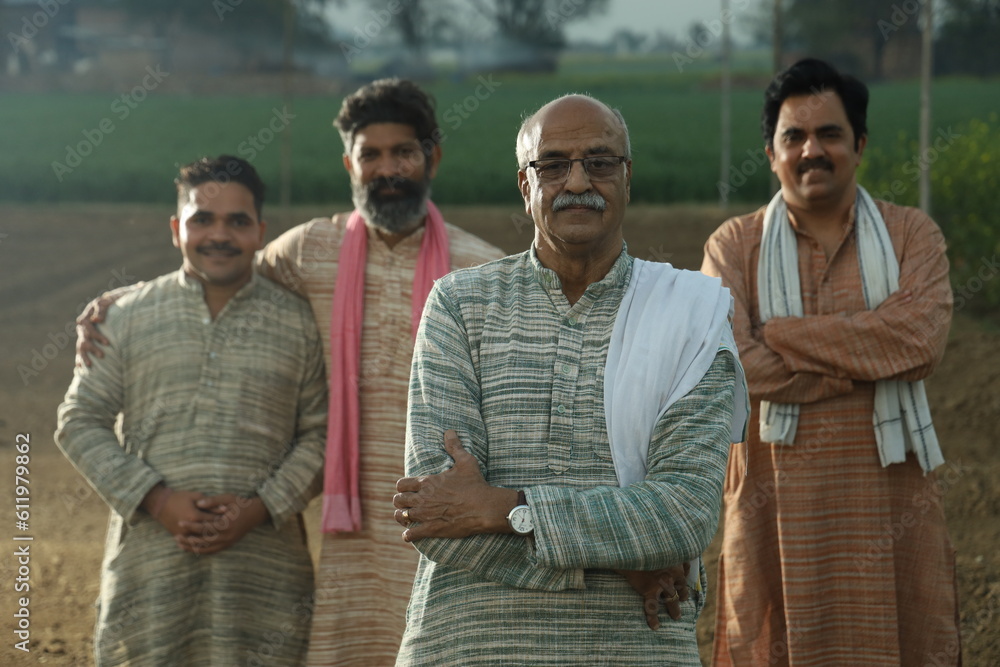 Beautiful portrait composition of Indian farmers standing in the field ...