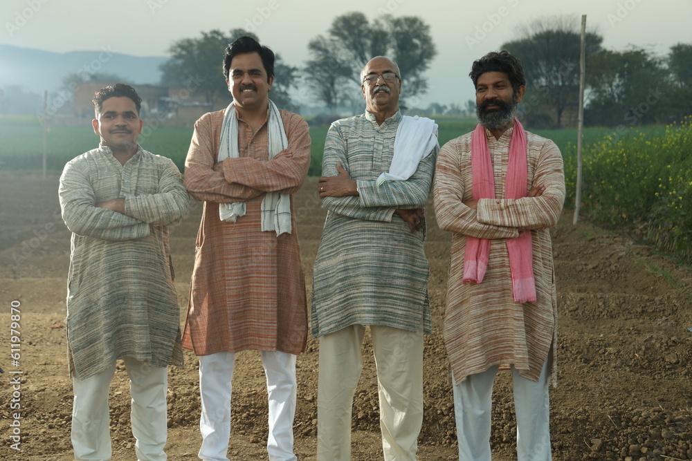 Beautiful portrait composition of Indian farmers standing in the field ...
