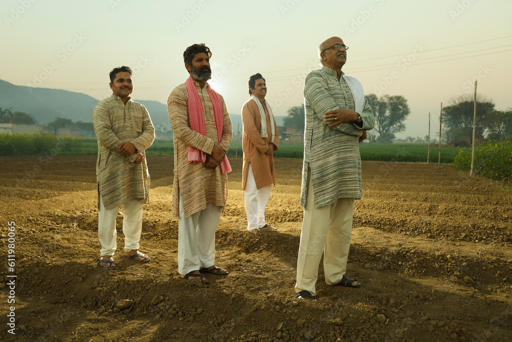 Beautiful portrait composition of Indian farmers standing in the field ...