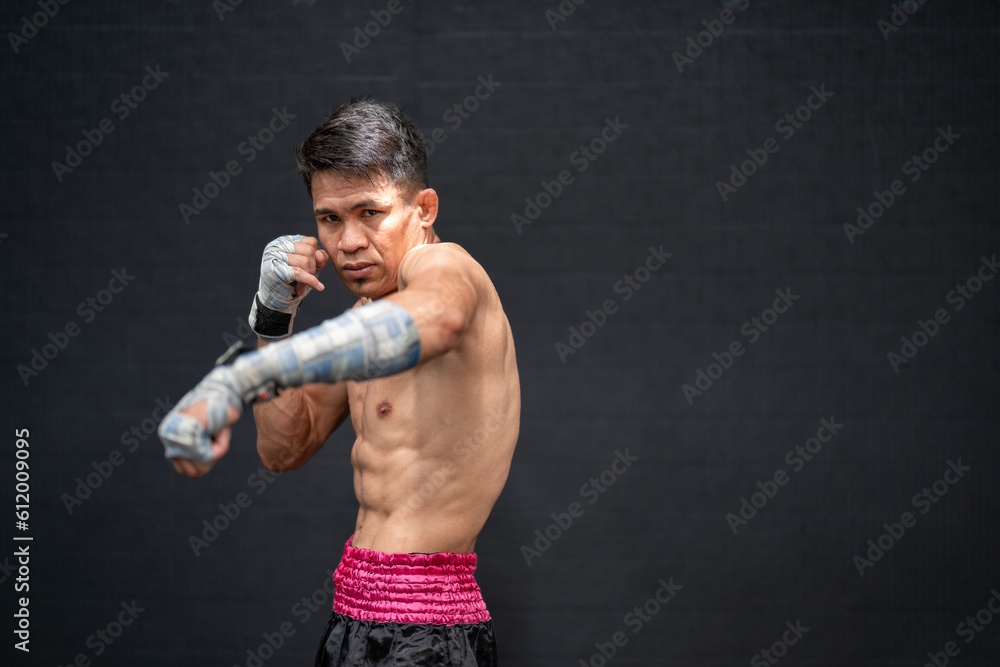 Confident Asian boxer athlete man shirtless preparing to fight in ...
