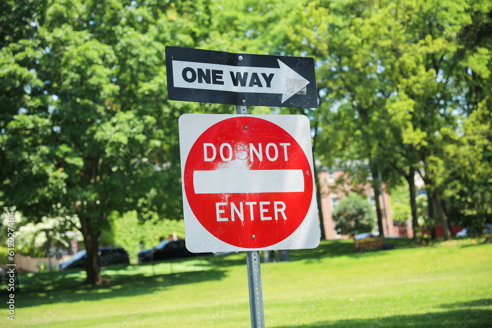 An imposing red 'Do Not Enter' sign stands tall, conveying a powerful ...