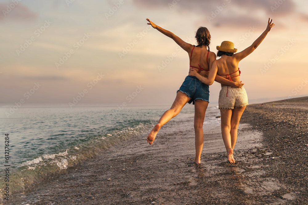 Sunset Beach Stroll: Joyful Friends Embracing Adventure - Two young ...