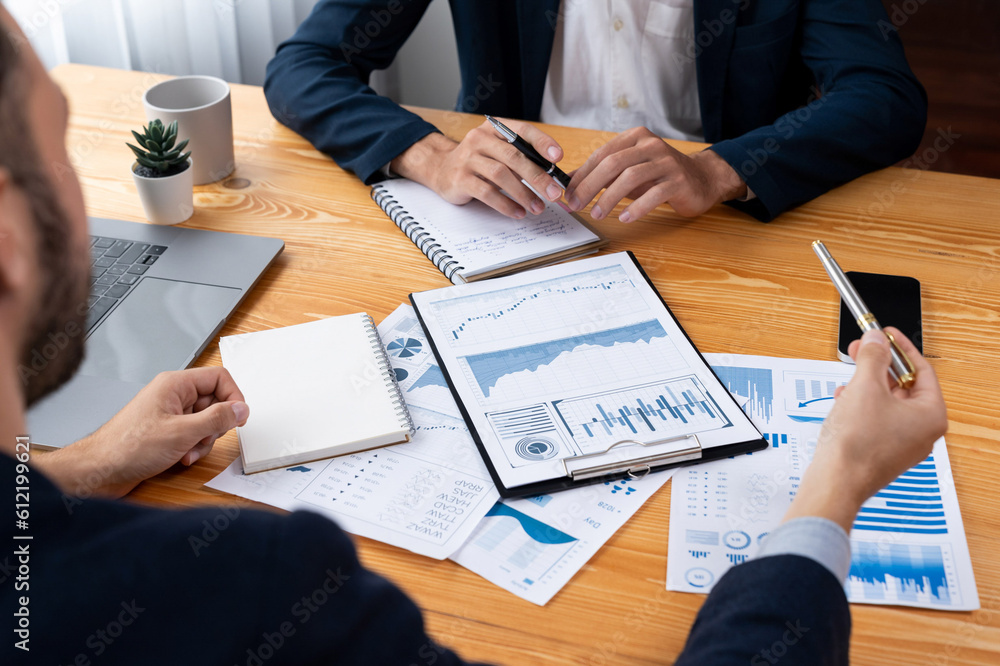 Busy analyst team in office analyzing financial data analysis for ...