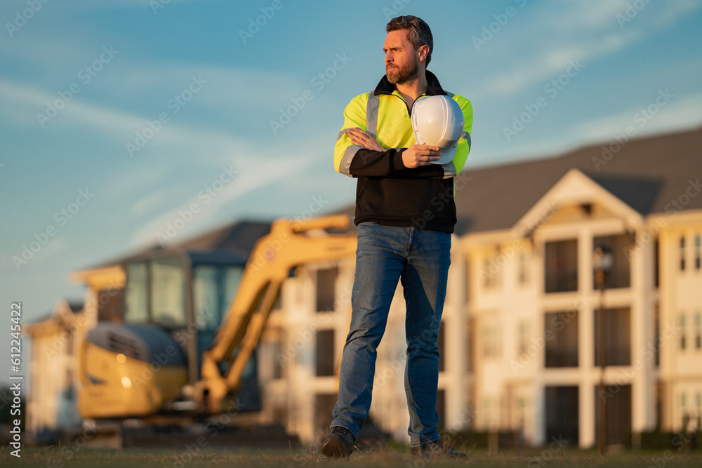 Worker in helmet on site construction. Man excavator bulldozer worker ...